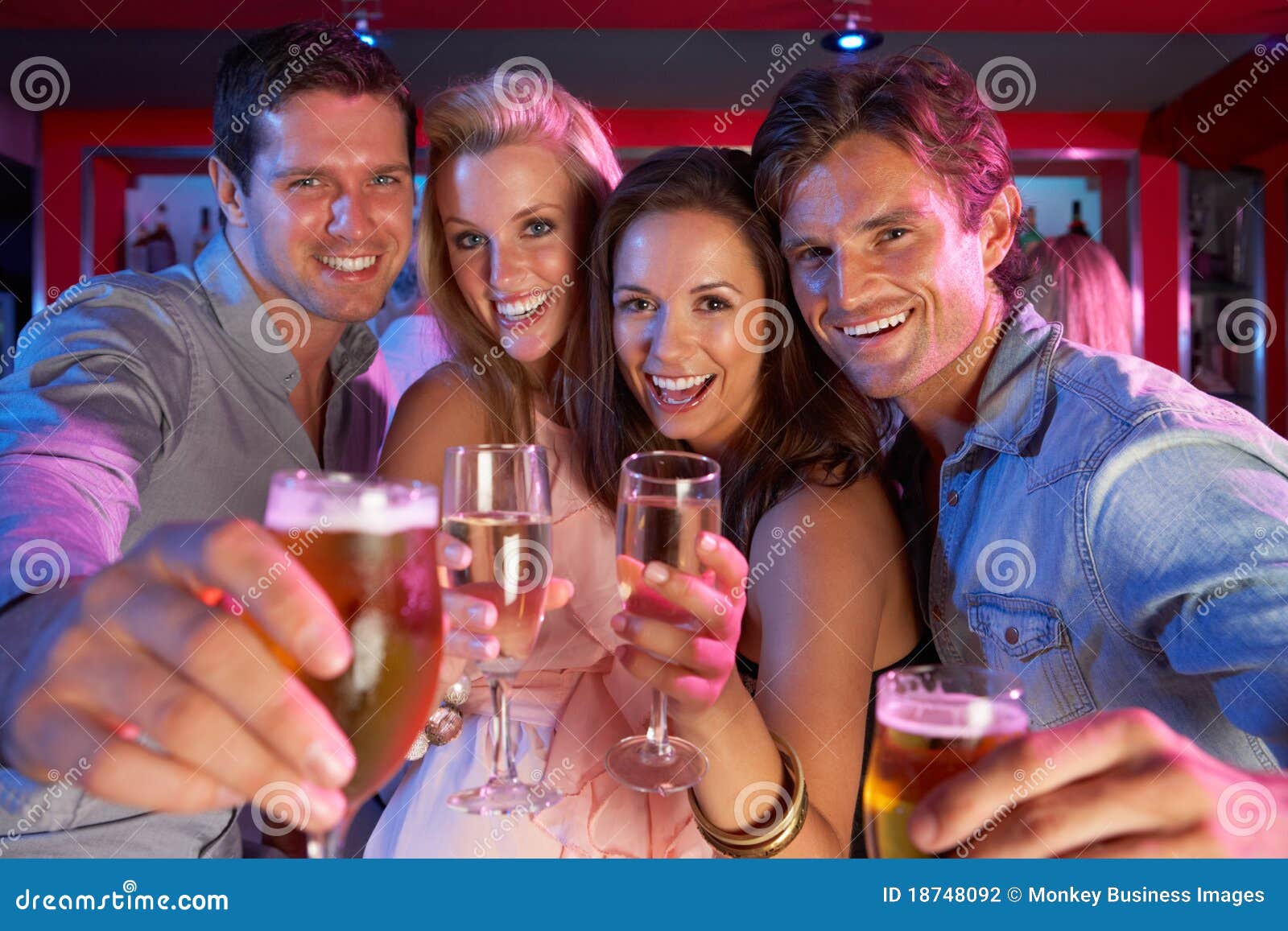 Group of Young People Having Fun in Busy Bar Stock Photo - Image of ...