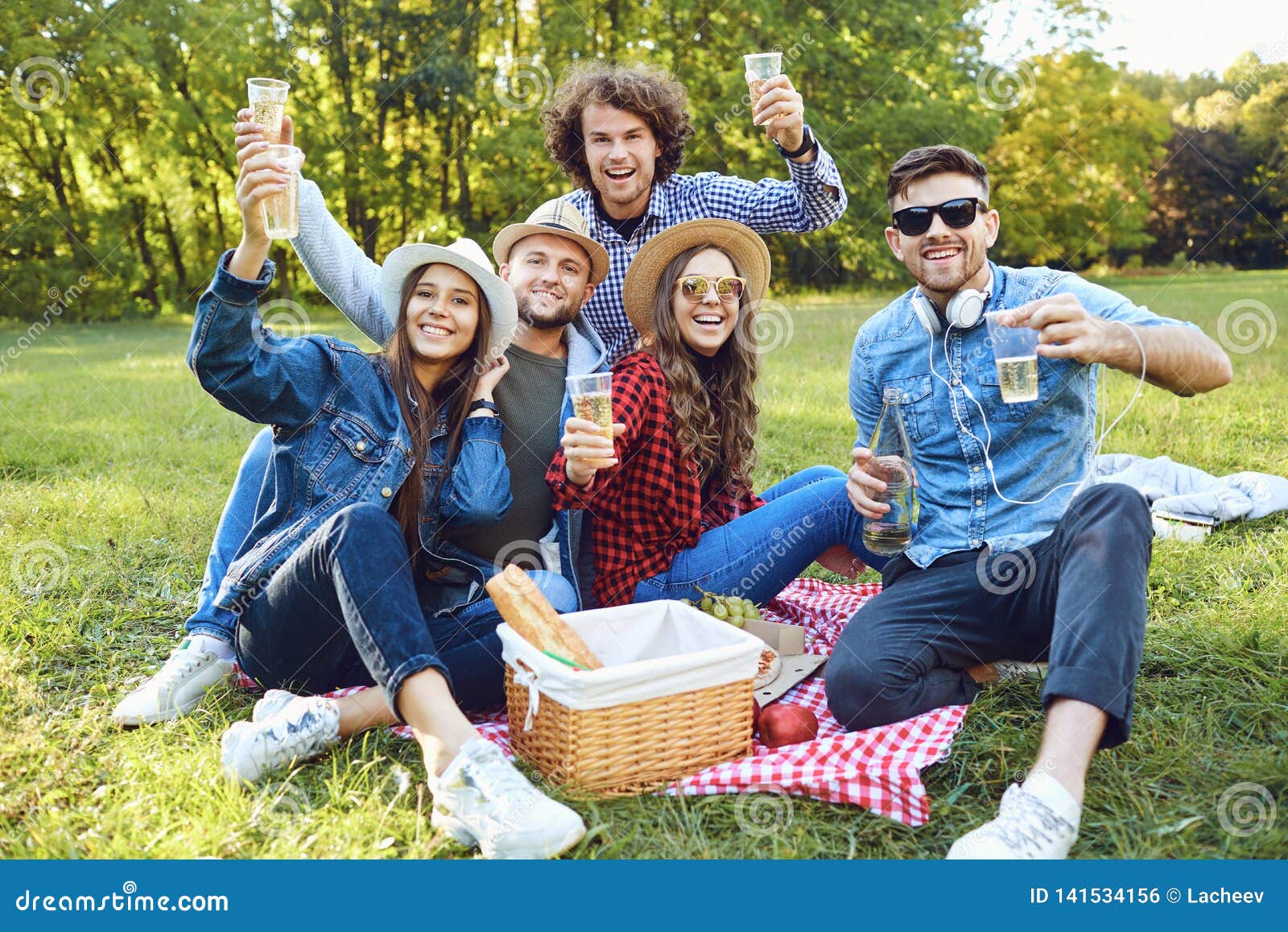 A Group of Young People Having on a Picnic in the Park. Stock Photo ...
