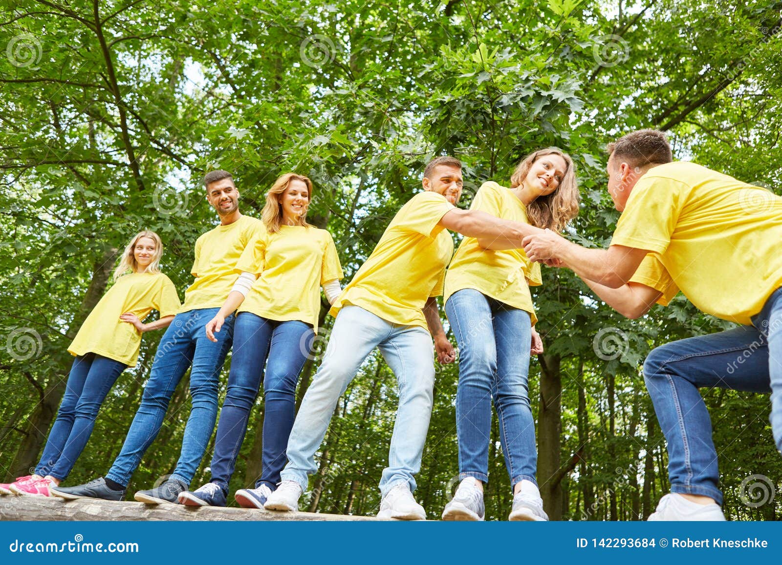 Group of Young People is Helping Each Other in Teamwork Stock Photo ...