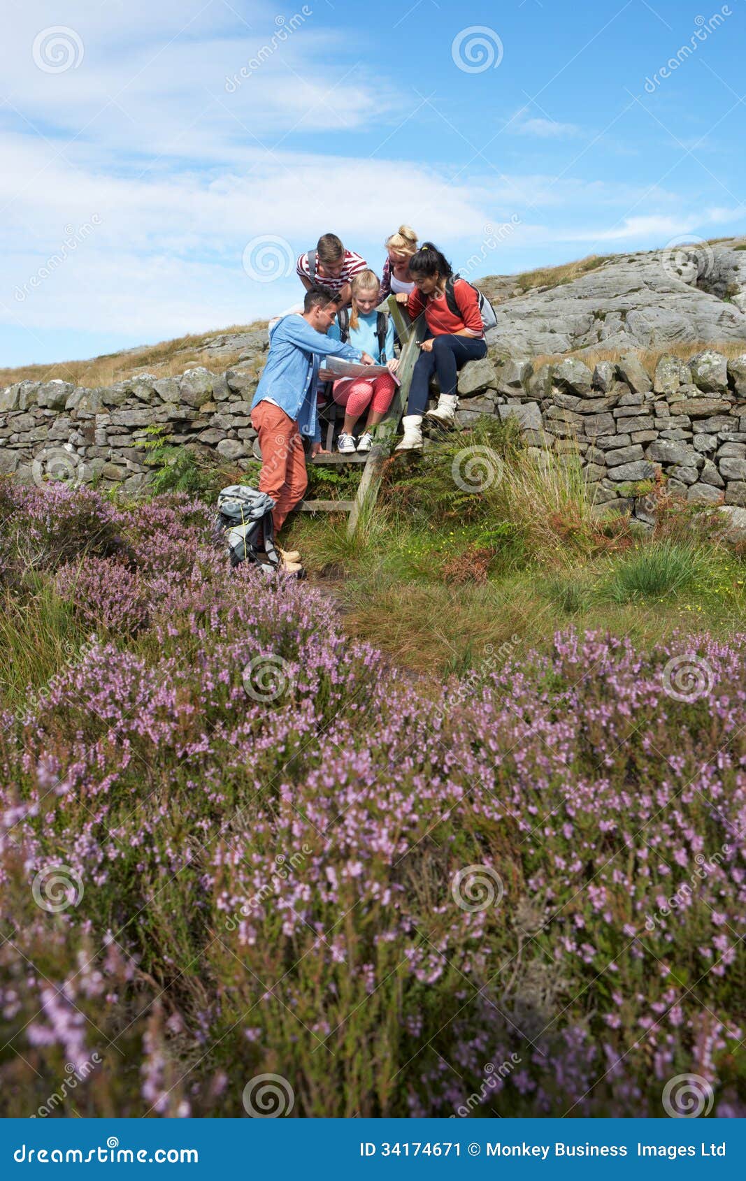 Group of Young People Hiking through Countryside Stock Image - Image of ...