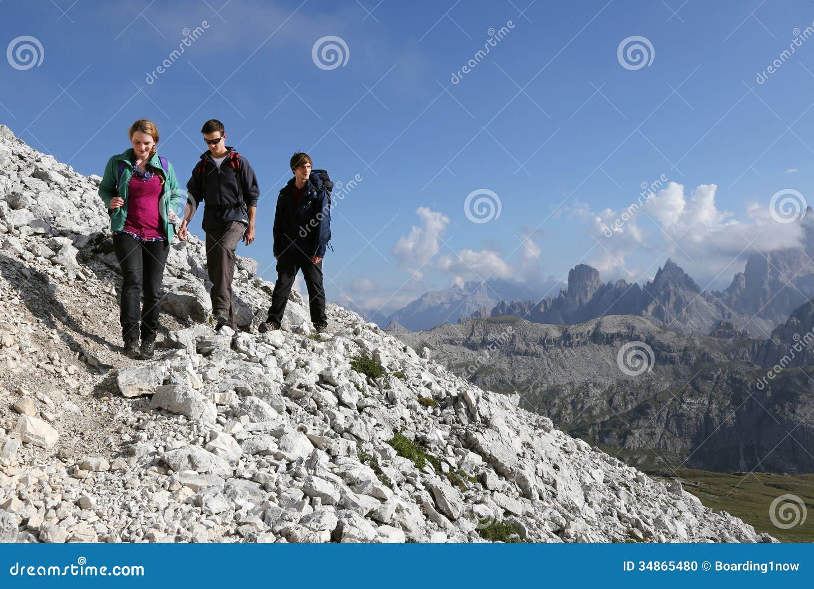 Group of Young People Hiking in the Mountains Stock Photo - Image of ...
