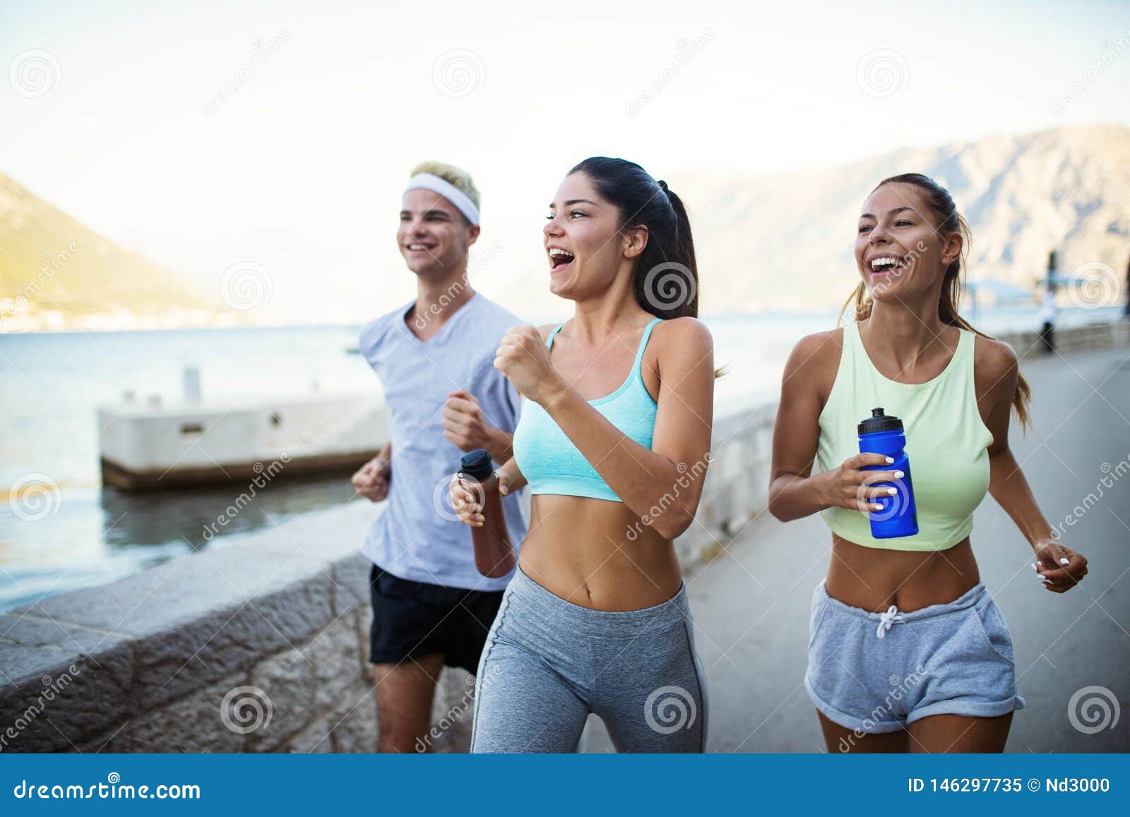 Group of Young People Jogging and Running Outdoors in Nature Stock ...