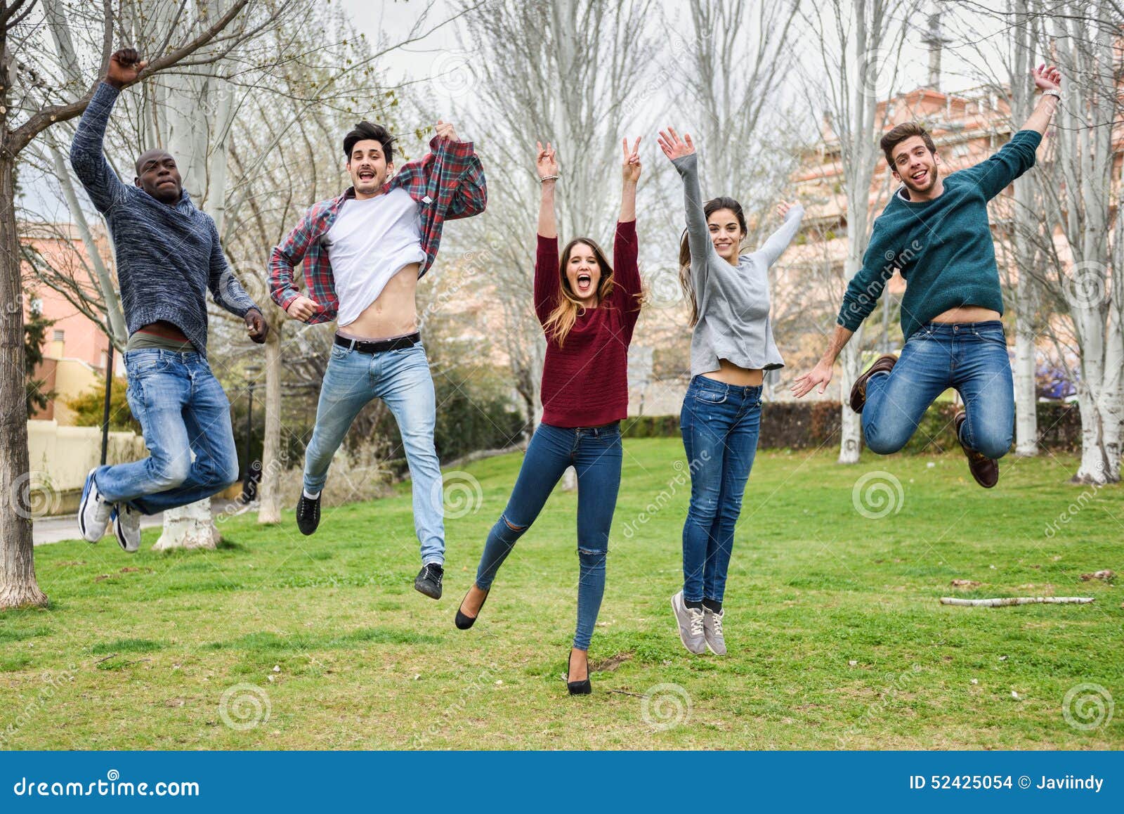 Group of Young People Jumping Together Outdoors Stock Photo - Image of ...