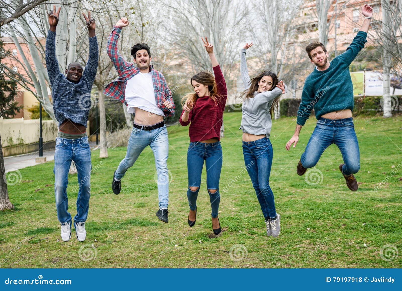 Group of Young People Jumping Together Outdoors Stock Photo - Image of ...