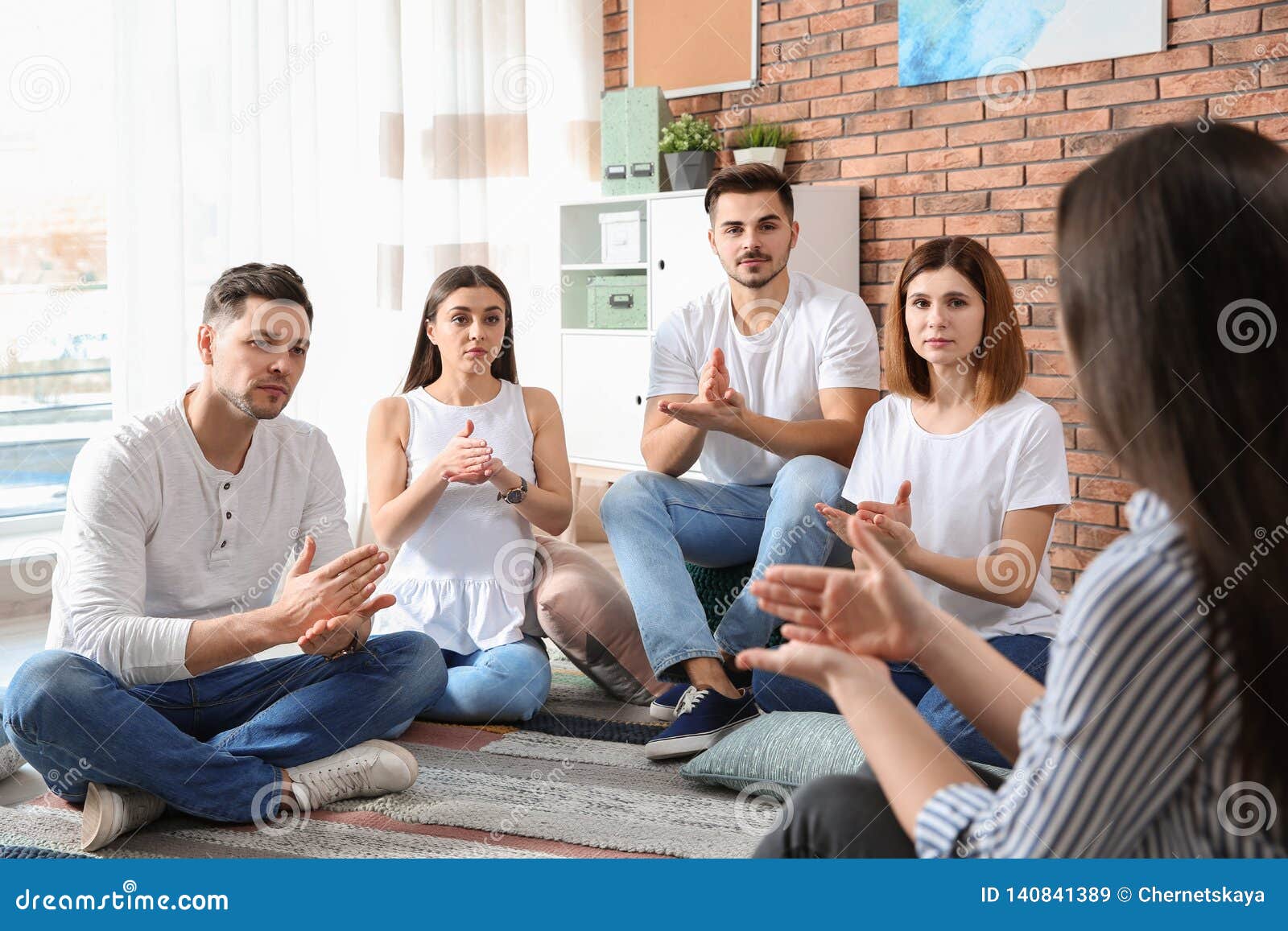 Group Of People Using Sign Language