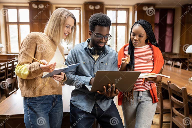 Group of Young People in the Library Looking Busy and Intersted Stock ...