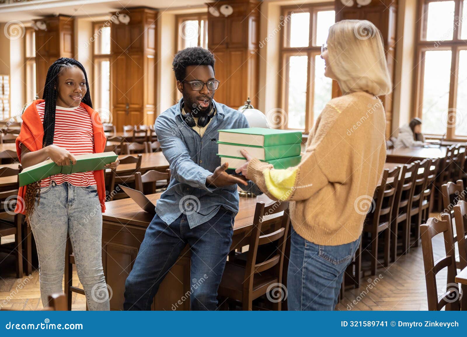 Group of Young People in the Library Looking Busy and Involved Stock ...