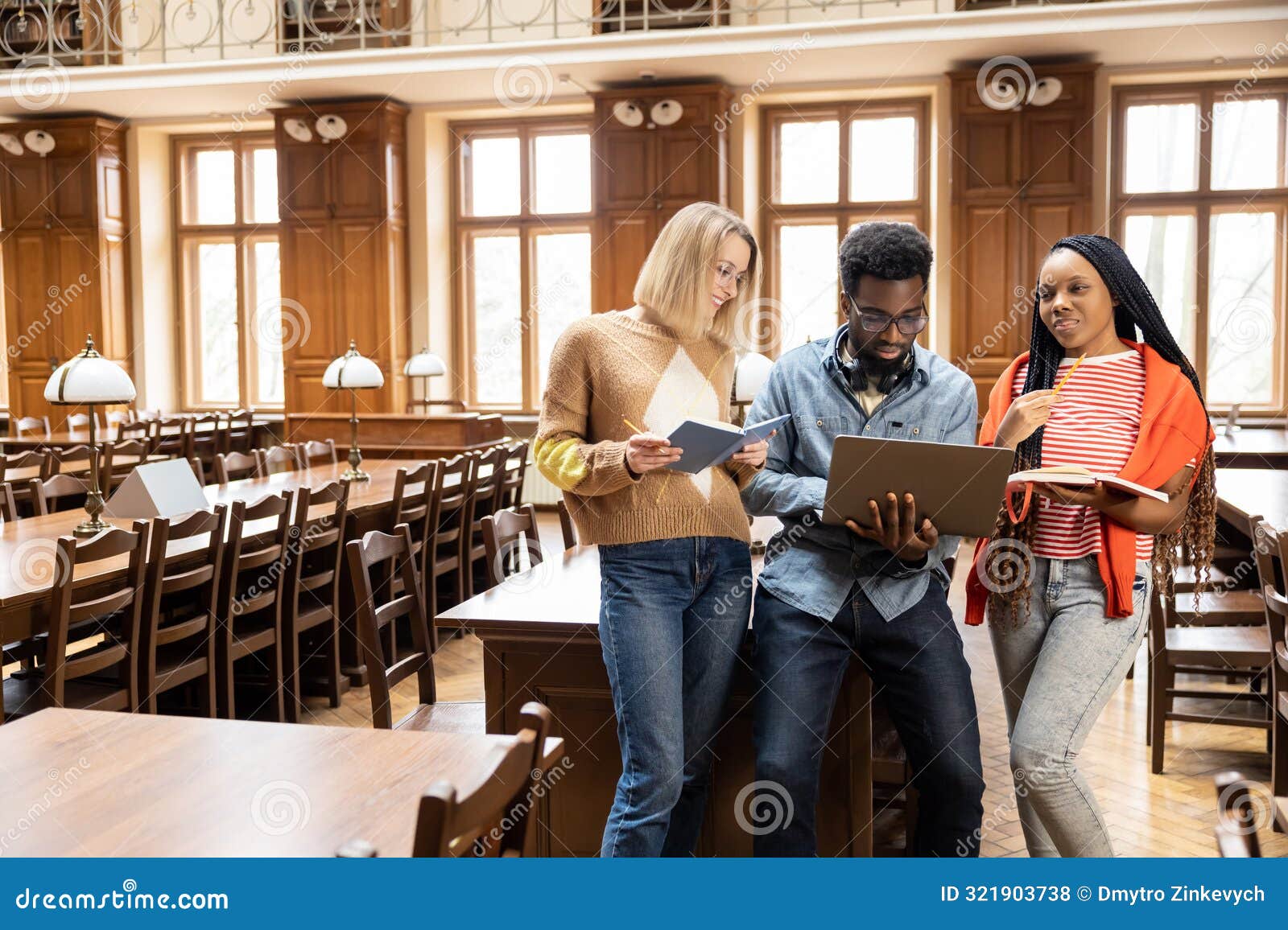 Group of Young People in the Library Looking Busy and Involved Stock ...