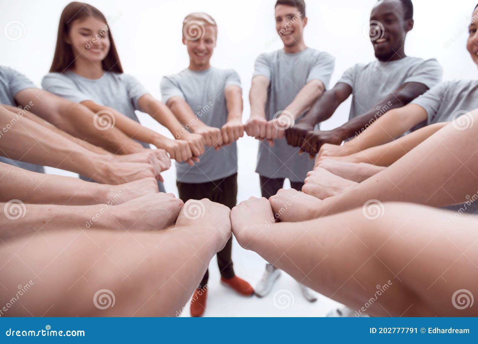 Group of Young People Making a Circle Out of Their Hands Stock Image ...