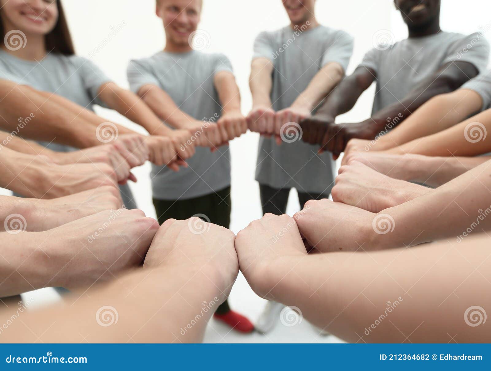Group of Young People Making a Circle Out of Their Hands Stock Photo ...
