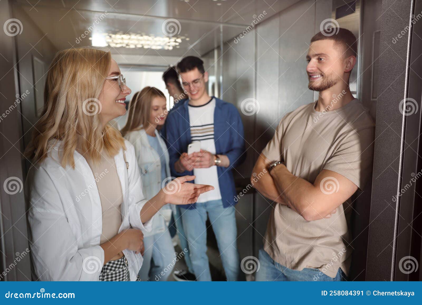 Group of Young People in Modern Elevator Stock Image - Image of male ...