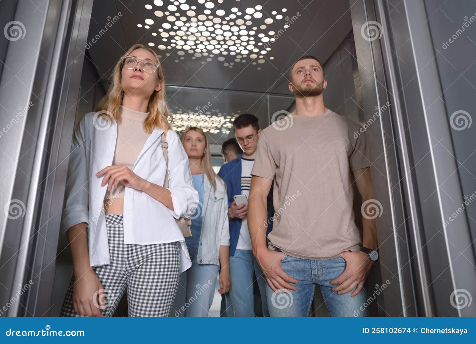 Group of Young People in Modern Elevator Stock Photo - Image of move ...
