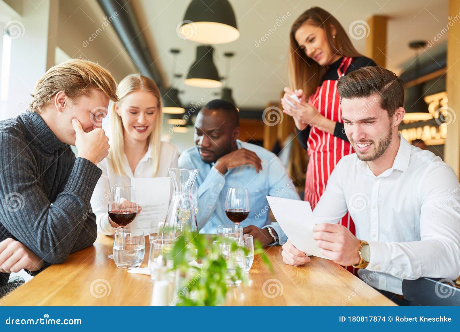 Group of Young People when Ordering in the Restaurant Stock Photo ...