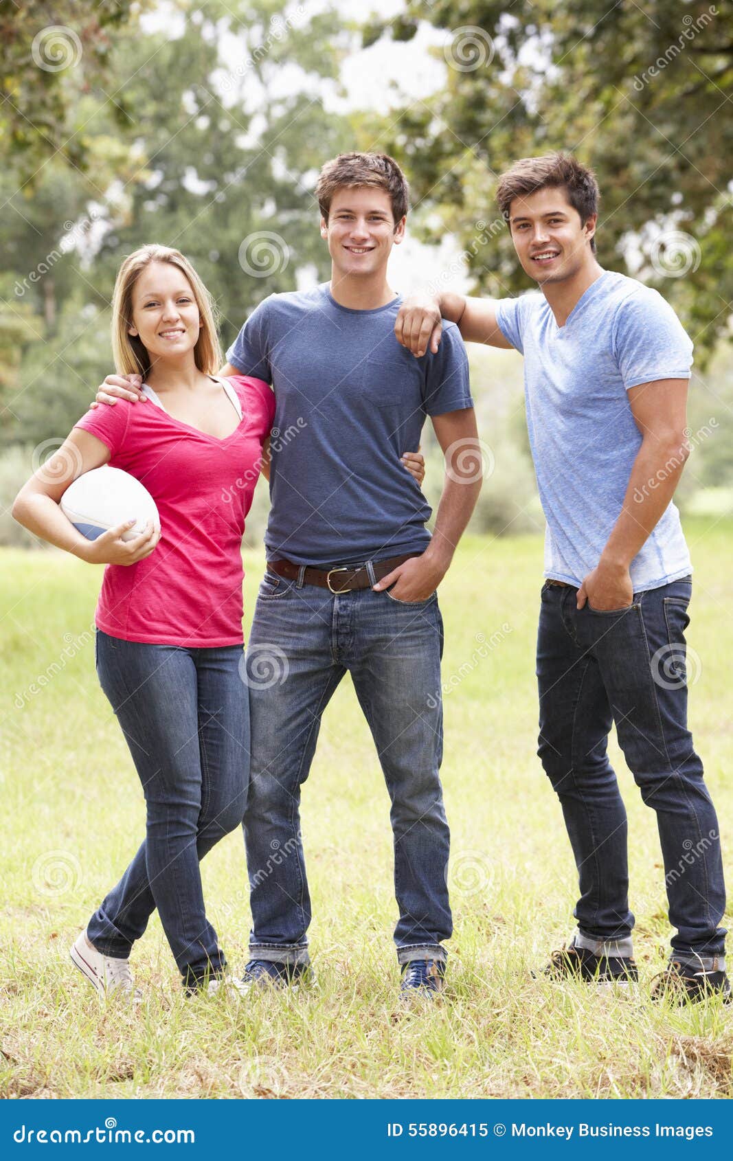 Group of Young People Playing with Rugby Ball in Countryside Stock ...