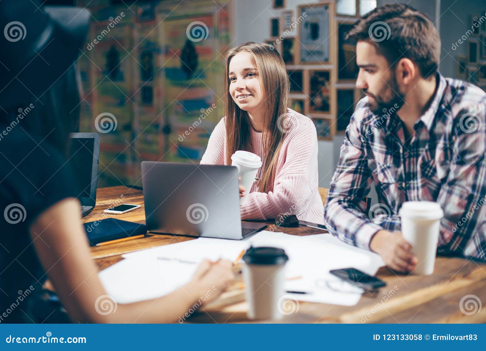 Group of Young People Preparing for the Seminar in a Cafe Stock Photo ...