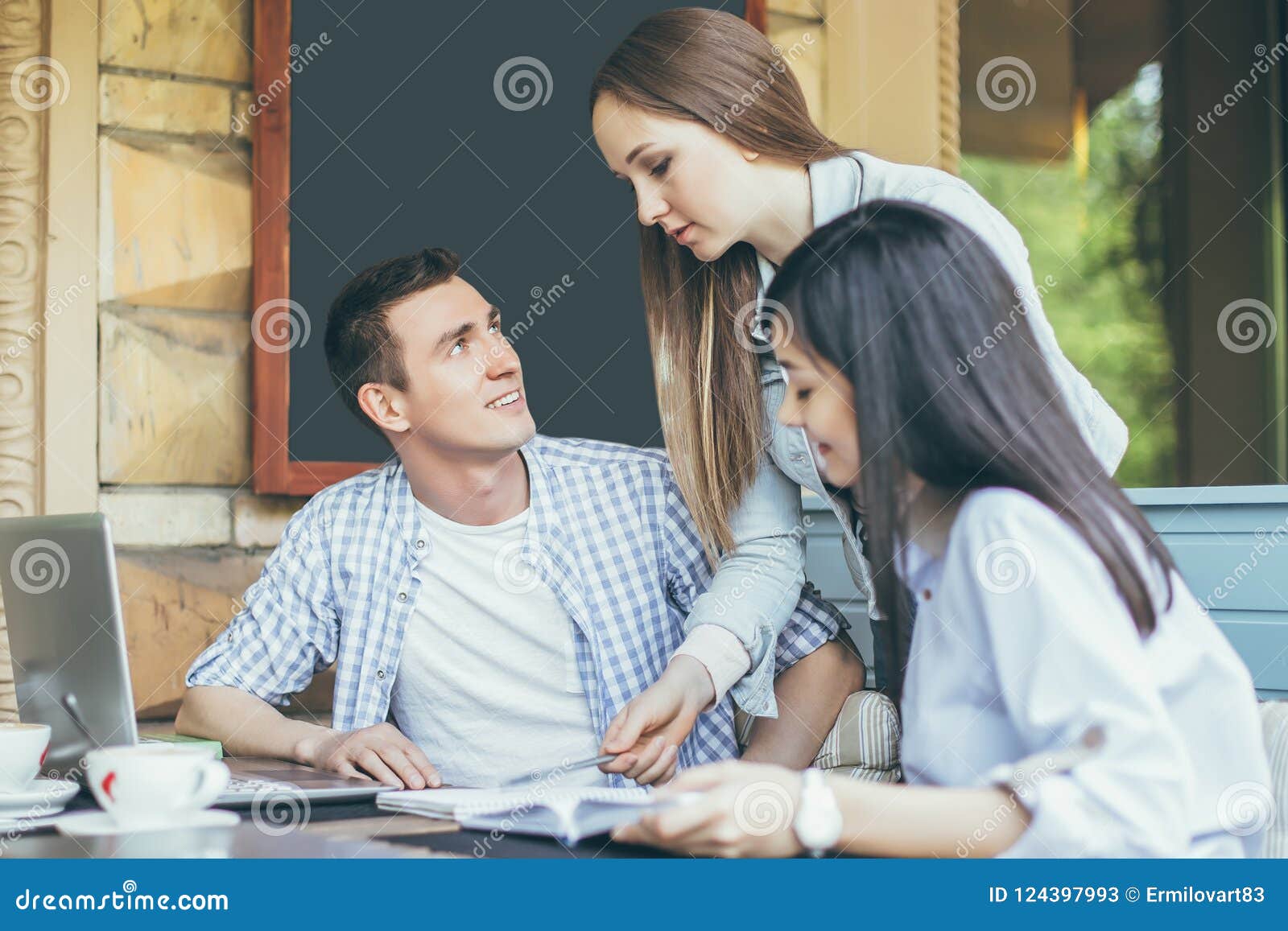 Group of Young People Preparing for the Seminar in a Cafe. Stock Image ...