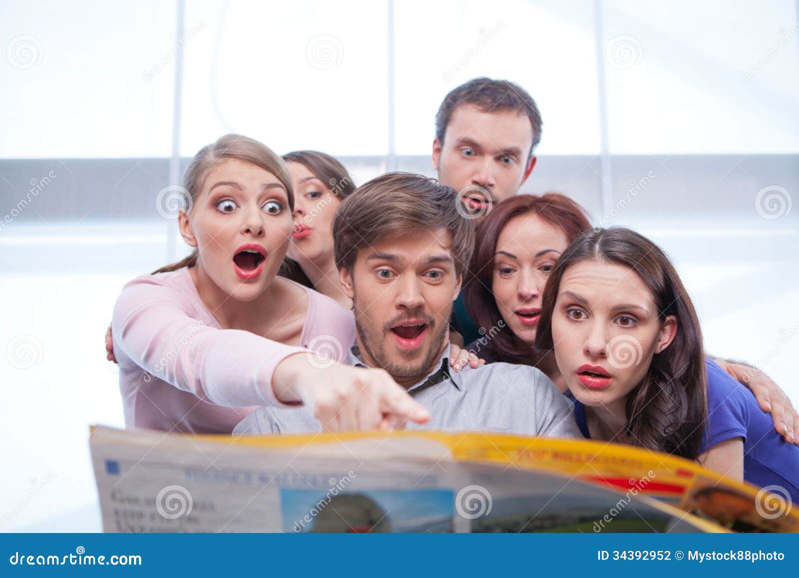 Group of Young People Reading Newspaper. Stock Photo - Image of ...