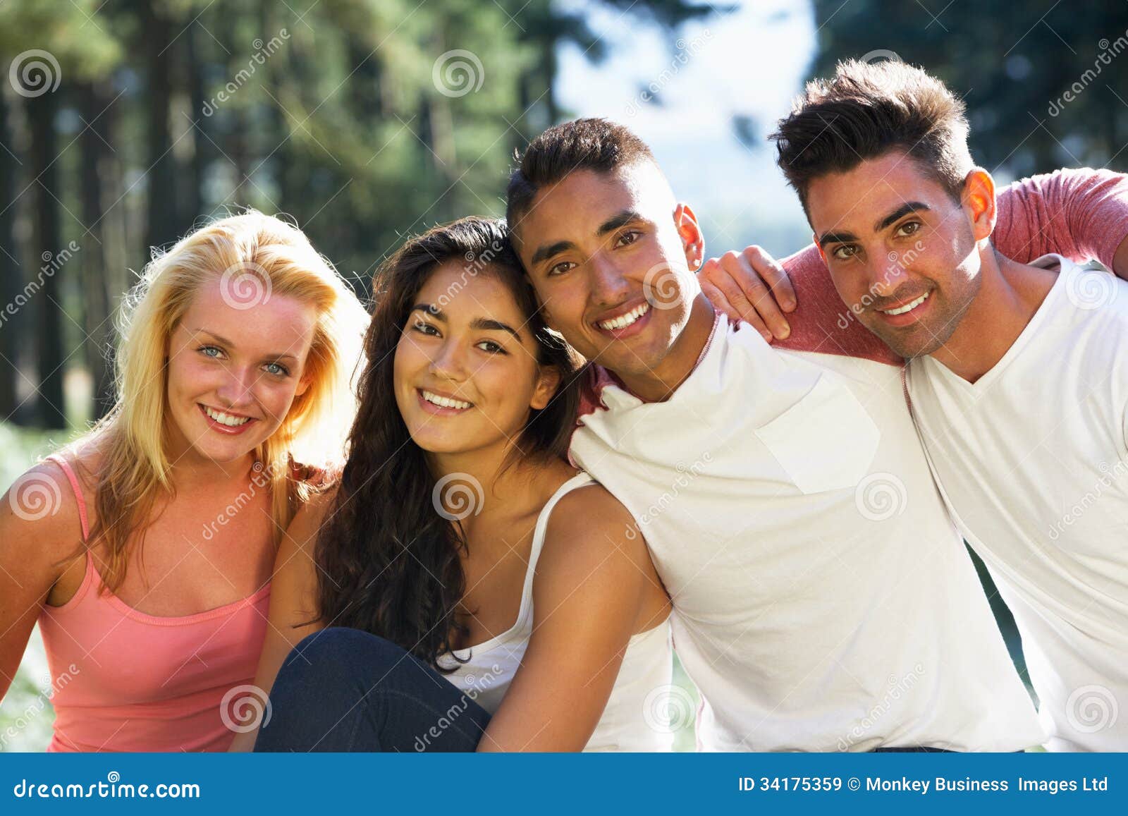 Group of Young People Relaxing in Countryside Stock Image - Image of ...