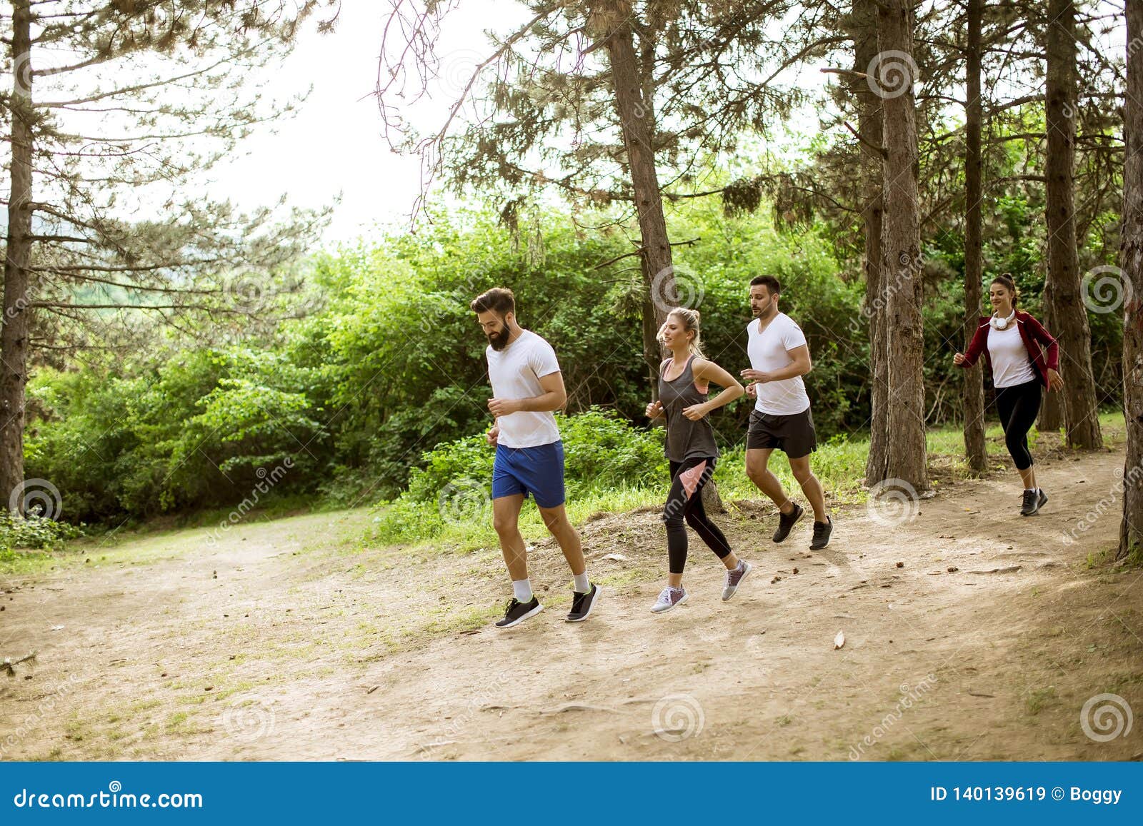 Group of Young People Run a Marathon through the Forest Stock Image ...