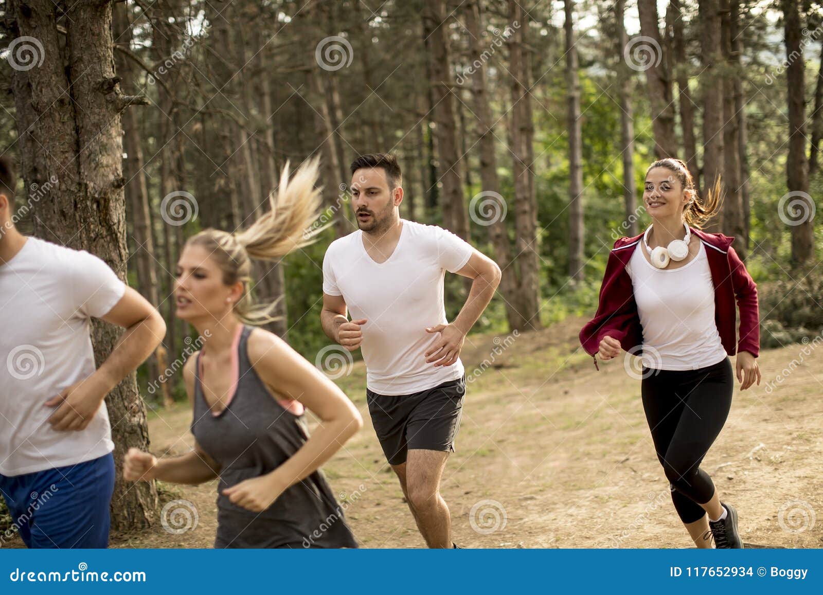 Young People Run a Marathon through the Forest Stock Photo - Image of ...