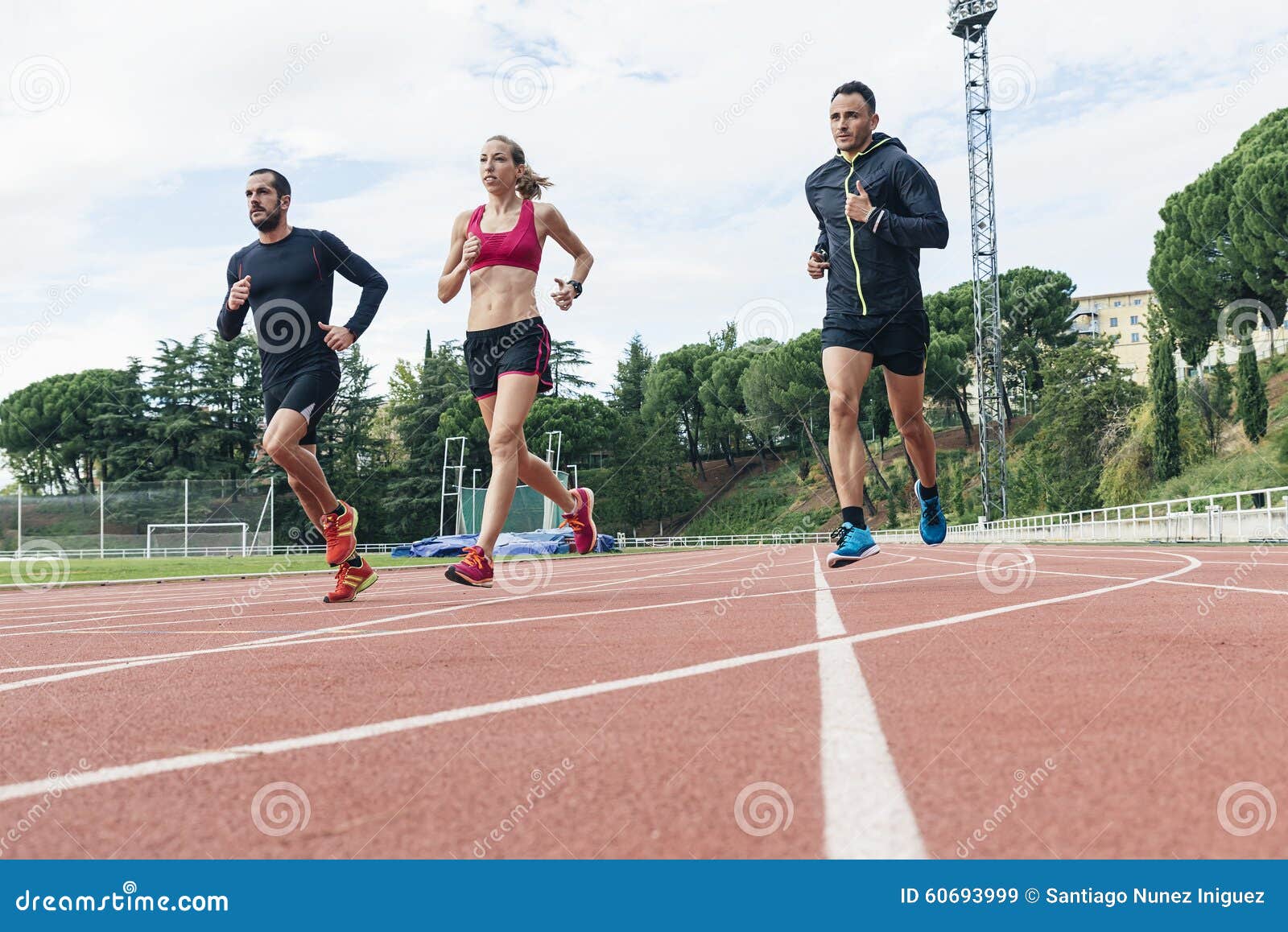 Group of Young People Running on the Track Field Stock Image - Image of ...