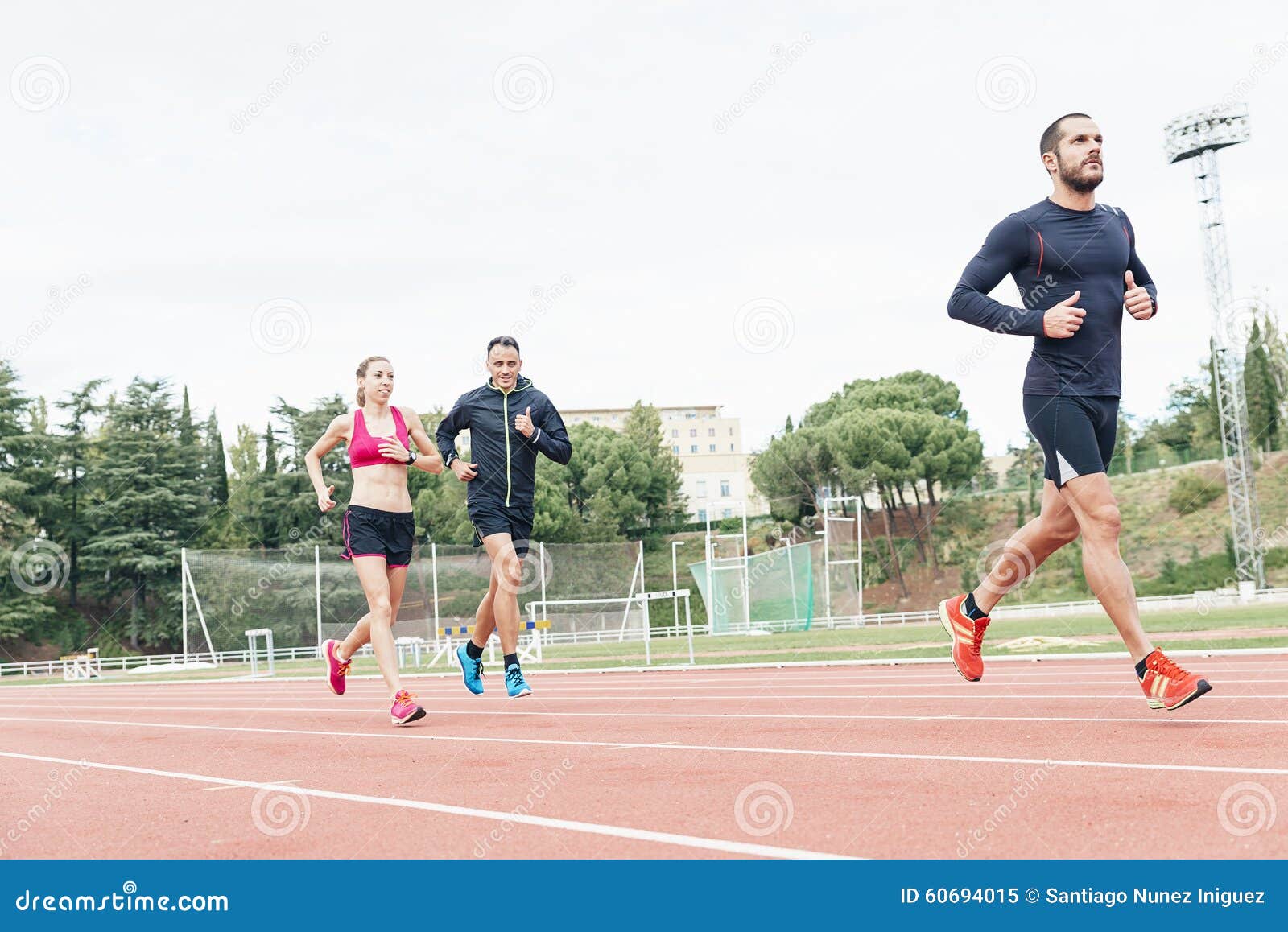 Group of Young People Running on the Track Field Stock Image - Image of ...