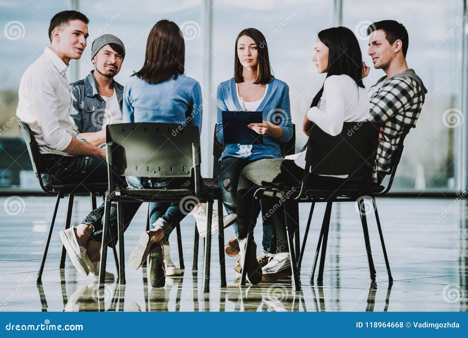 Group of Young People Sitting on Chairs in Circle Stock Photo - Image ... Group of Young People Sitting on Chairs in Circle Stock Photo - Image ...