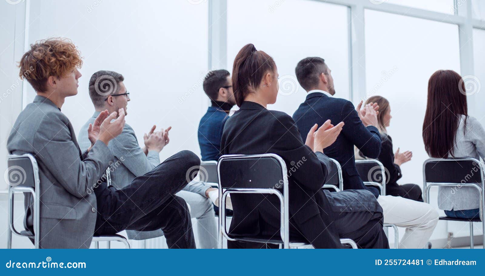 Group of Young People Sitting on Chairs in the Conference Room Stock ...