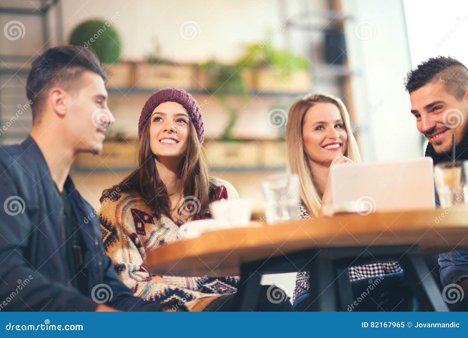 Group of Young People Sitting in a Coffee Shop Stock Image - Image of ...
