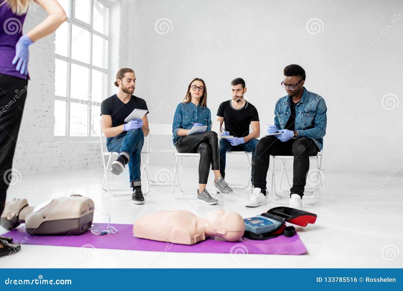Group of Young People Sitting during the First Aid Training Stock Photo ...