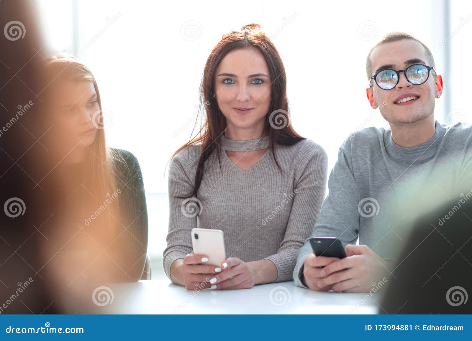 Group of Young People Sitting at a Round Table Stock Image - Image of ...