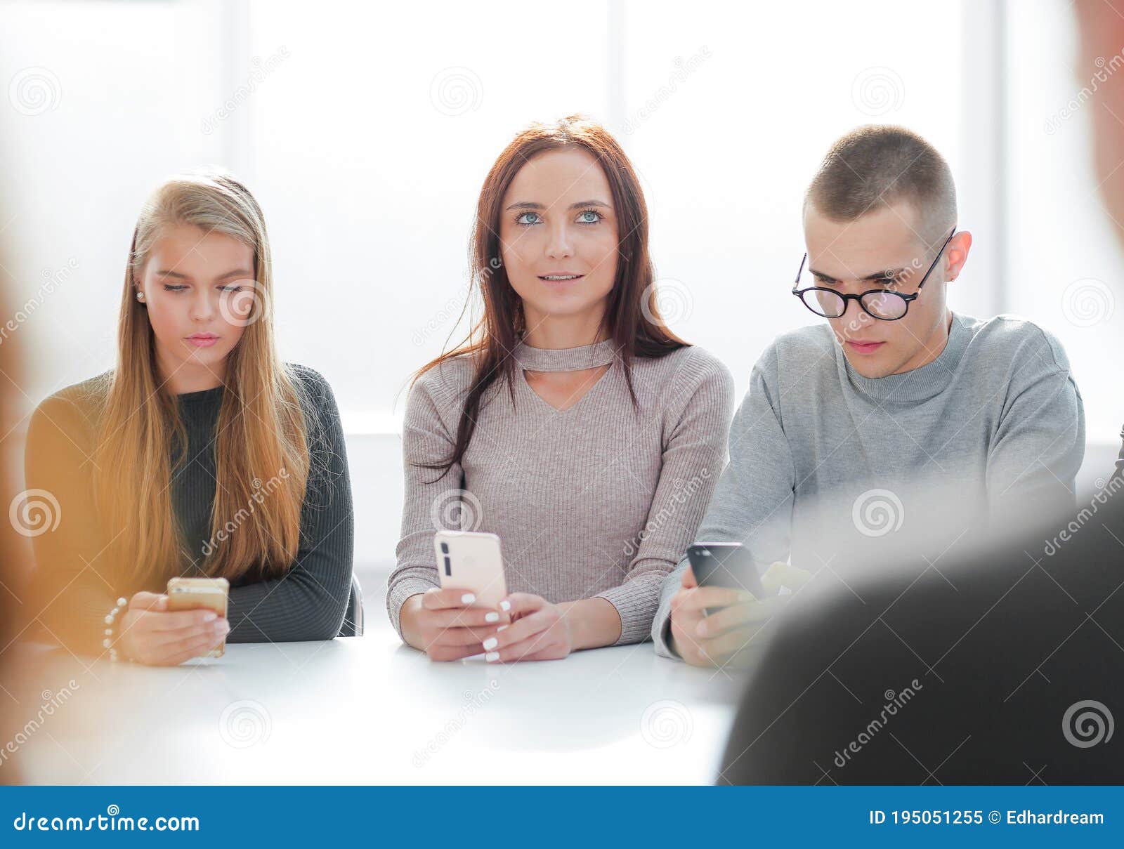 Group of Young People Sitting at a Round Table Stock Image - Image of ...
