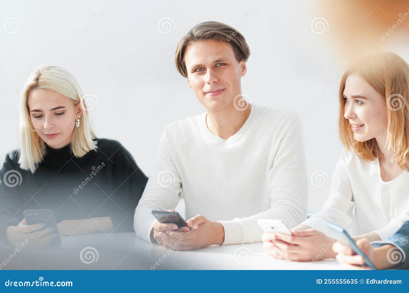 Group of Young People Sitting at a Round Table Stock Image - Image of ...