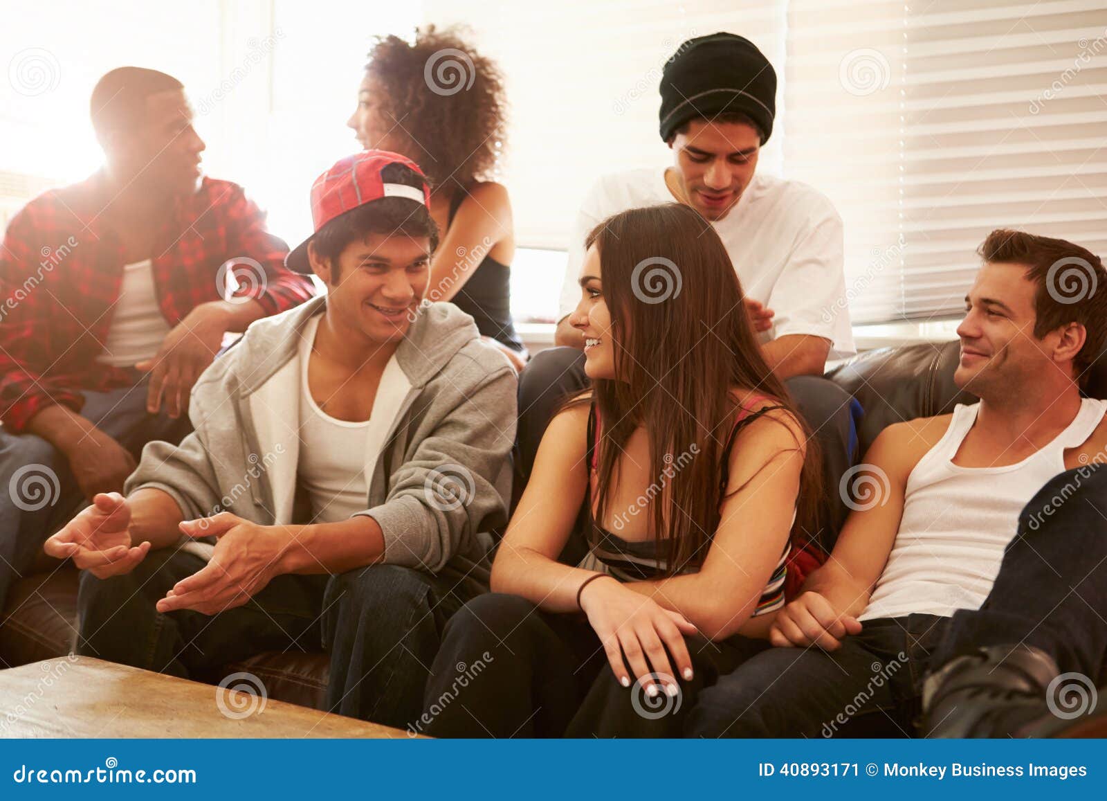 Group of Young People Sitting on Sofa and Talking Stock Image - Image ...