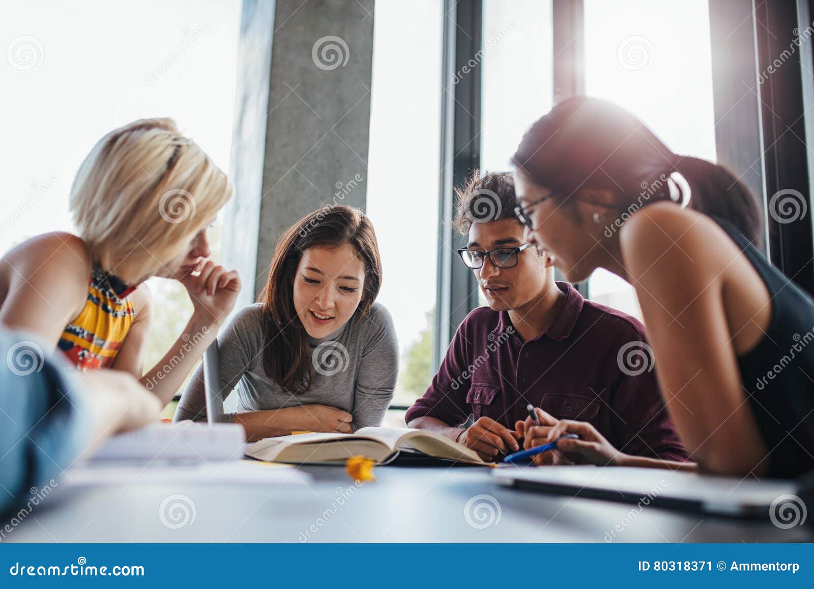 Group of Young People Sitting at Table Reading Books Stock Image ... Group of Young People Sitting at Table Reading Books Stock Image ...