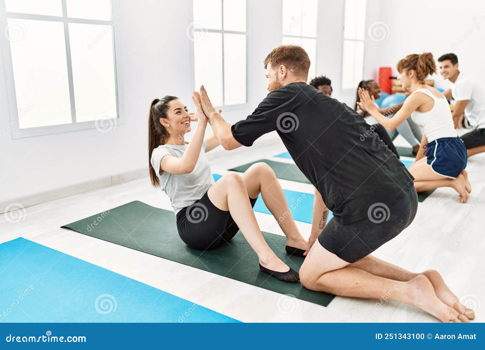 Group of Young People Smiling Happy Training Abdominal Exercise at ...
