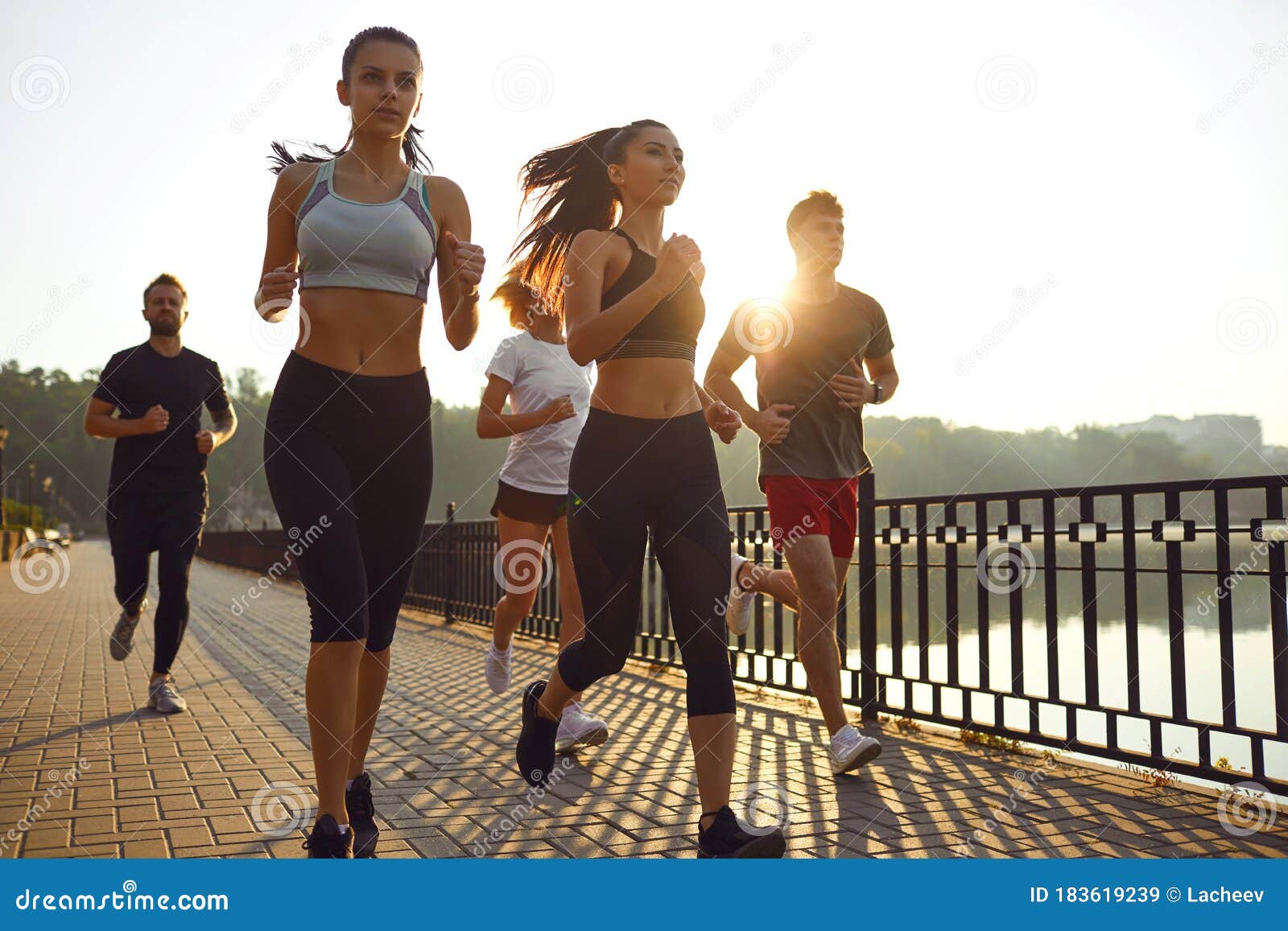 A Group of Young People are Running in the Park. Stock Image - Image of ...