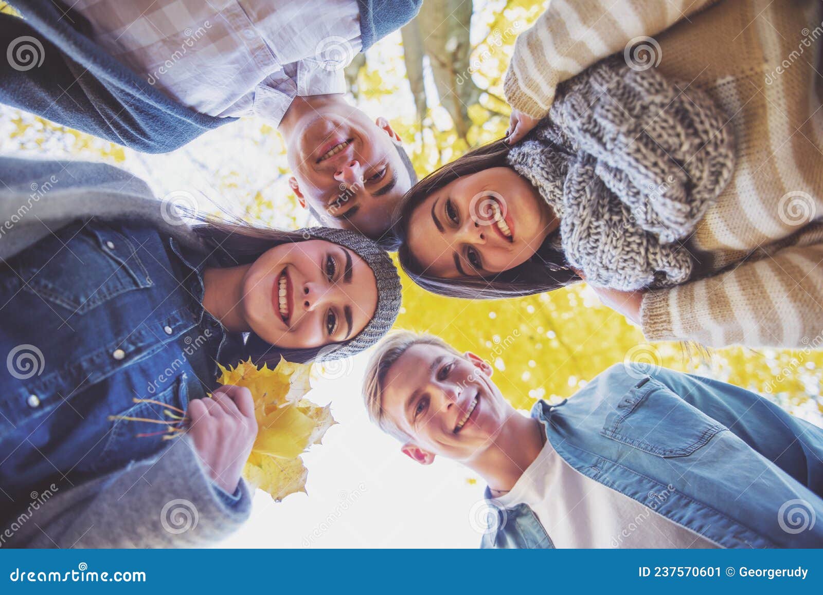 Students in autumn park stock image. Image of phone - 237570601