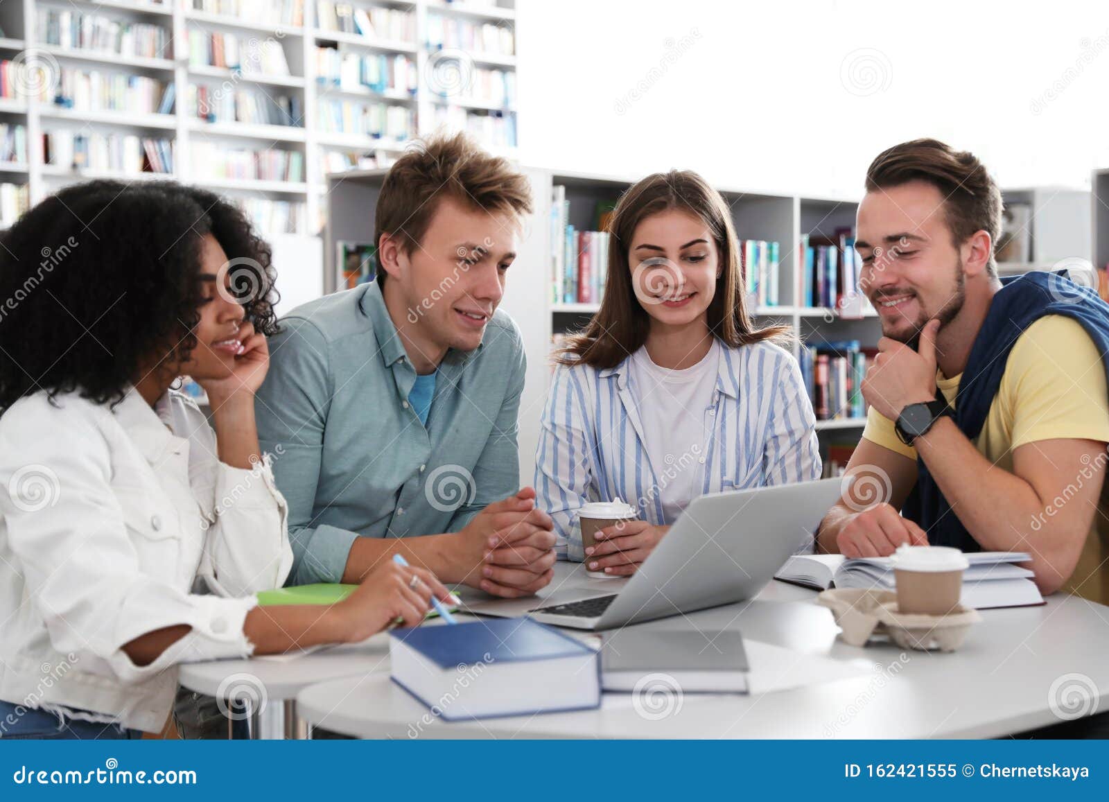 Group of Young People Studying at Table Stock Image - Image of adult ...