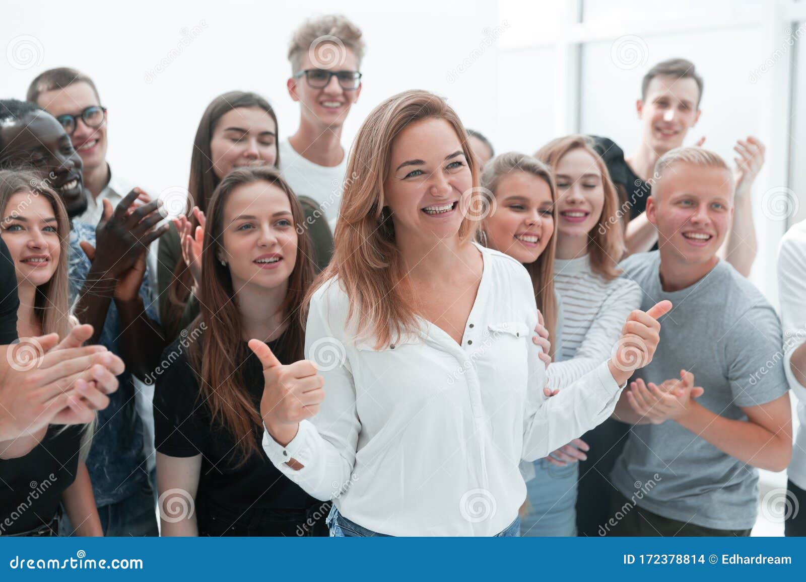 Group of Young People Supporting Their Happy Leader Stock Photo - Image ...