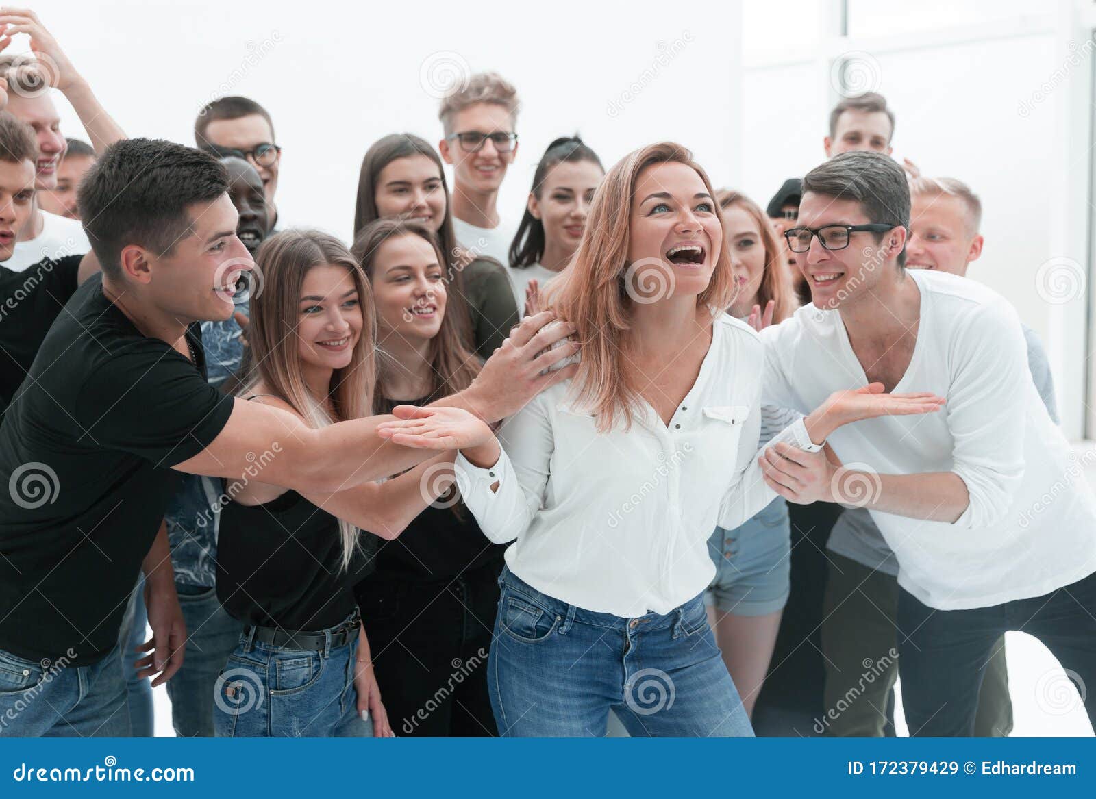 Group of Young People Supporting Their Happy Leader Stock Image - Image ...