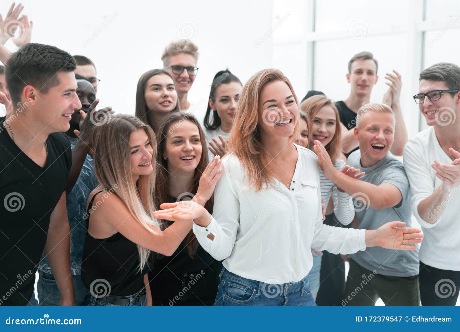 Group of Young People Supporting Their Happy Leader Stock Image - Image ...