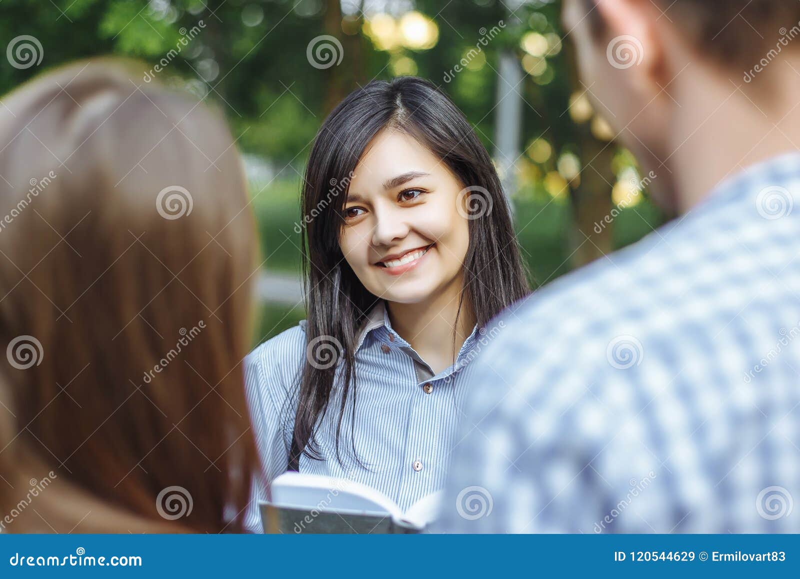 Group of Young People Talking and Smiling Outdoors Stock Image - Image ...