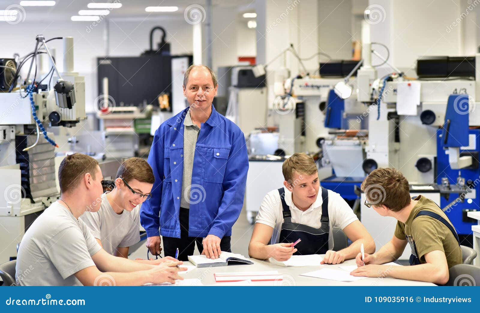 Group of Young People in Technical Vocational Training with Teacher ...