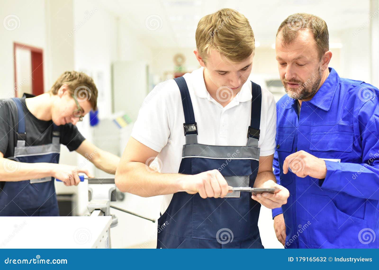 Group of Young People in Technical Vocational Training with Teacher ...