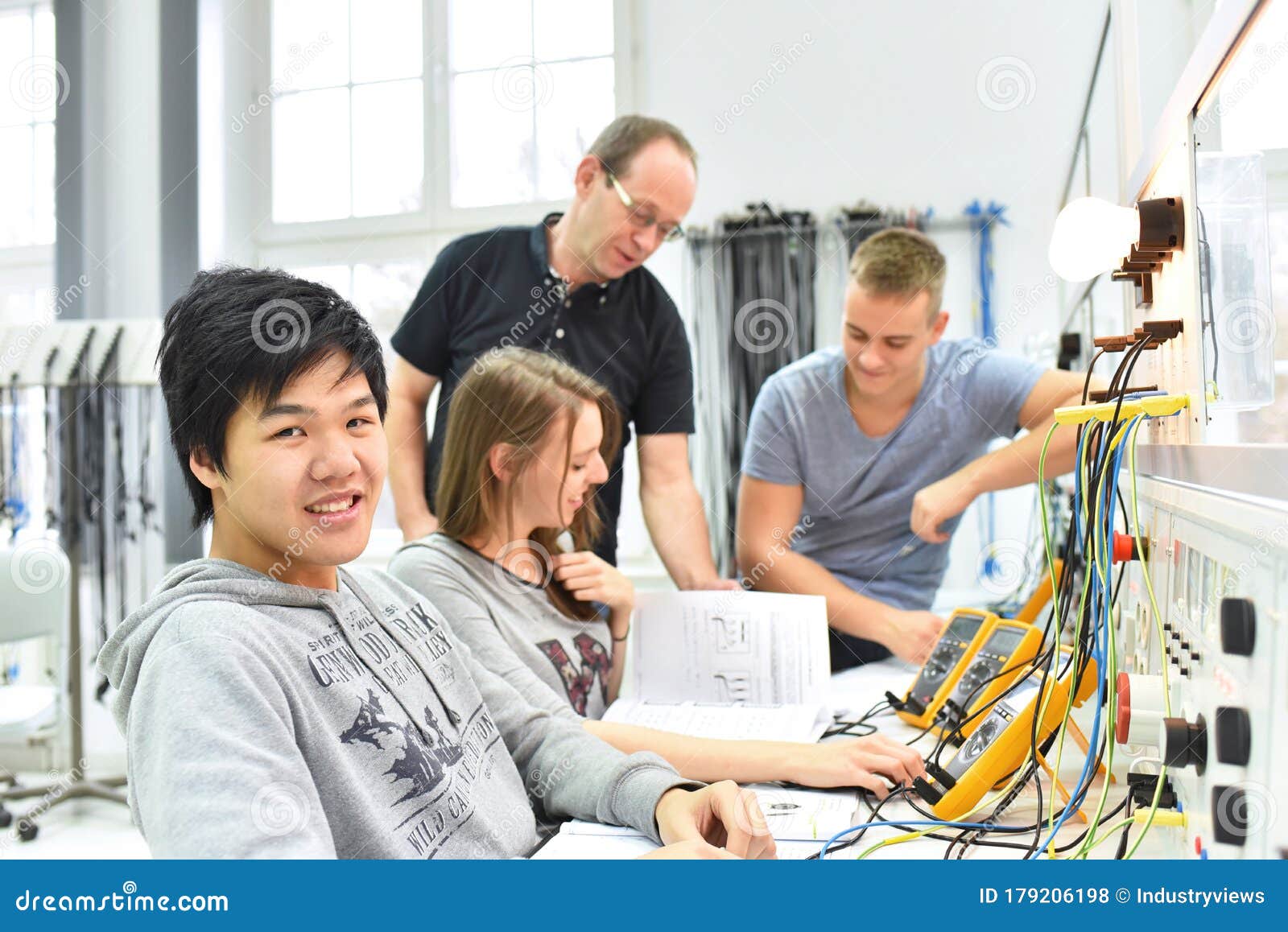 Group of Young People in Technical Vocational Training with Teacher ...