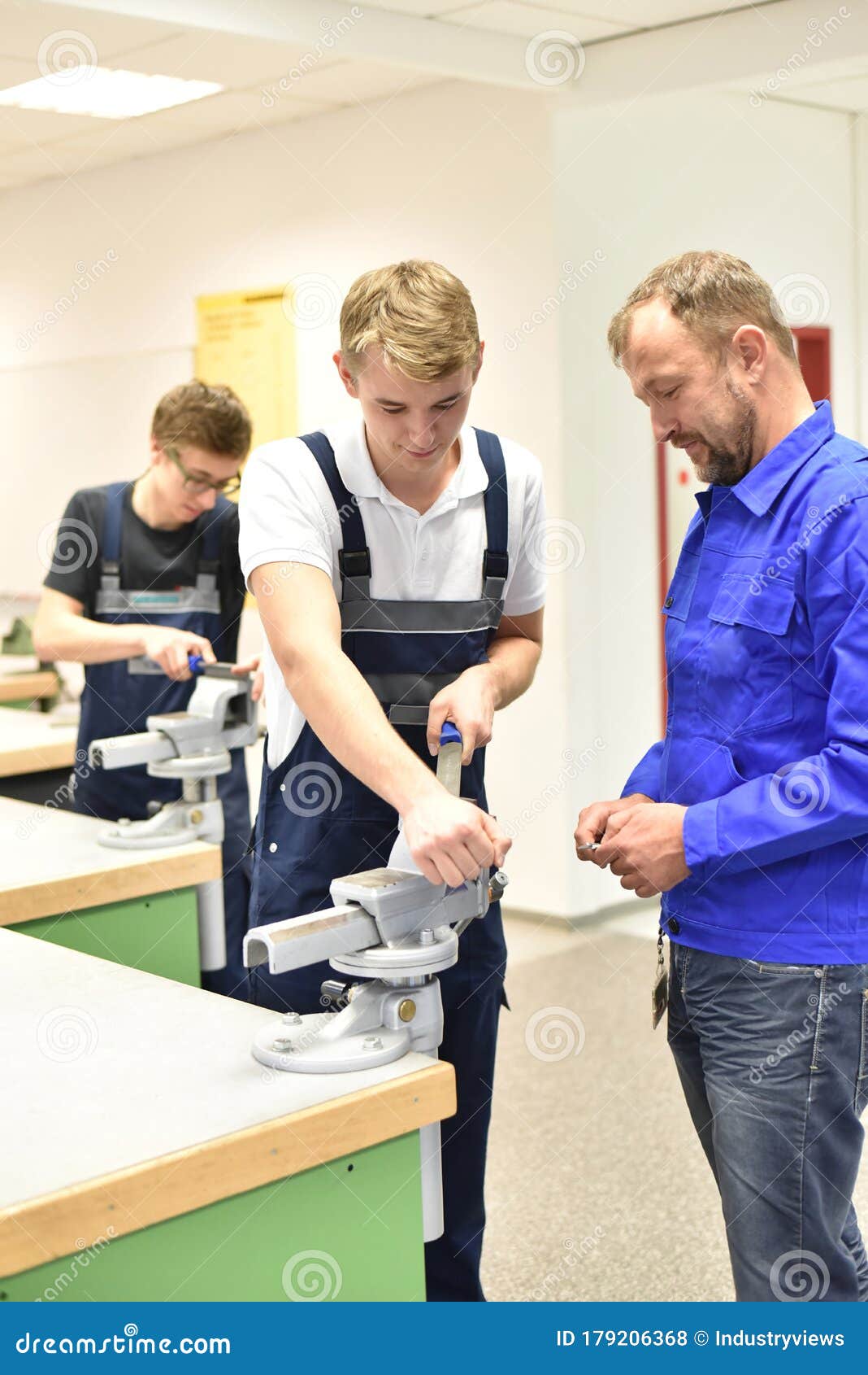 Group of Young People in Technical Vocational Training with Teacher ...