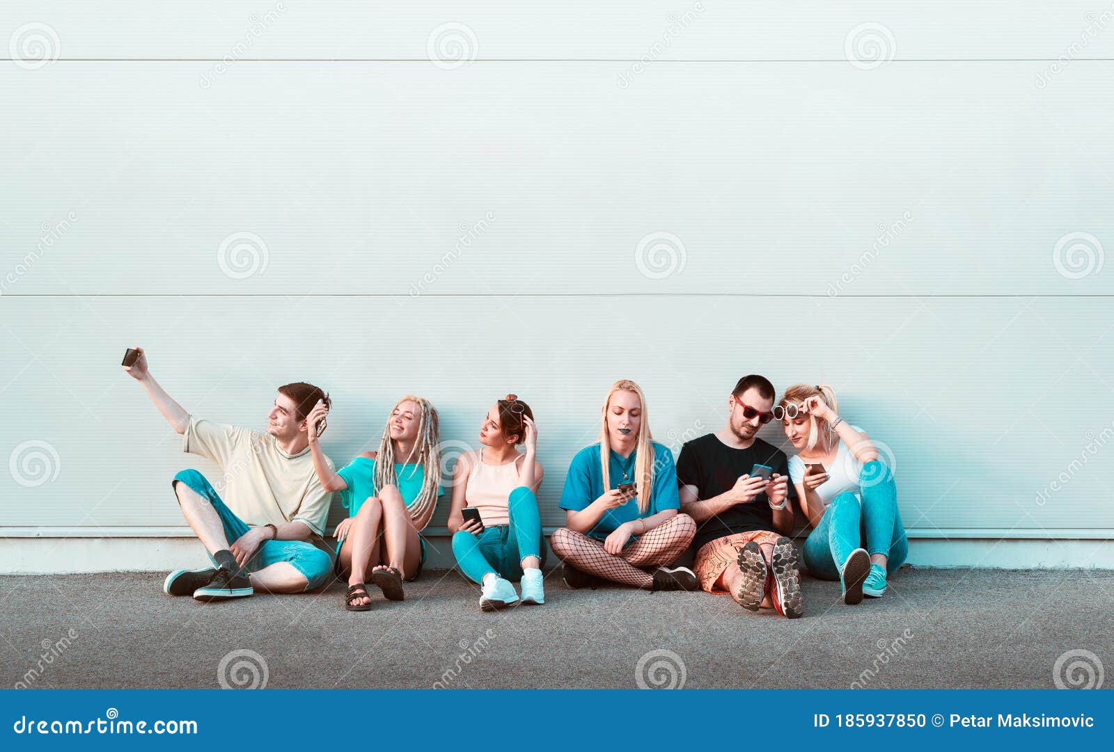 Group of Young People Using Their Mobile Phones Stock Photo - Image of ...