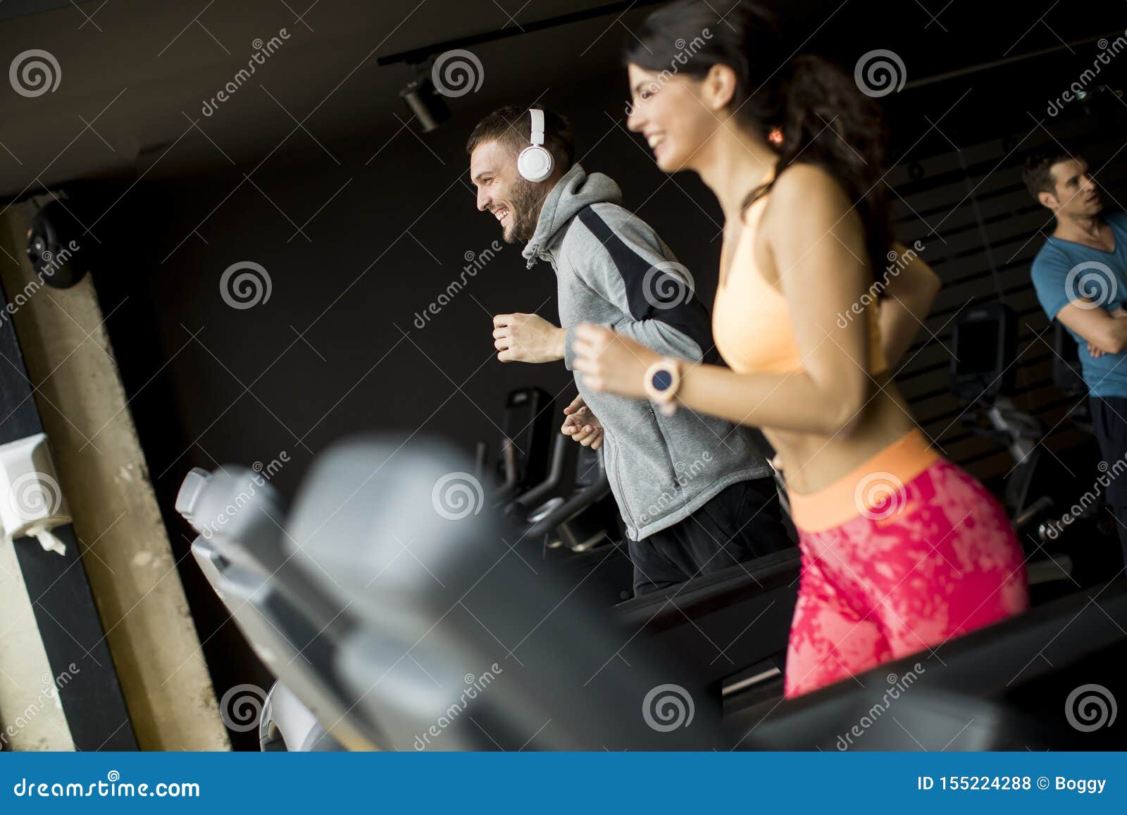 Young People Using Threadmill in Modern Gym Stock Photo - Image of ...