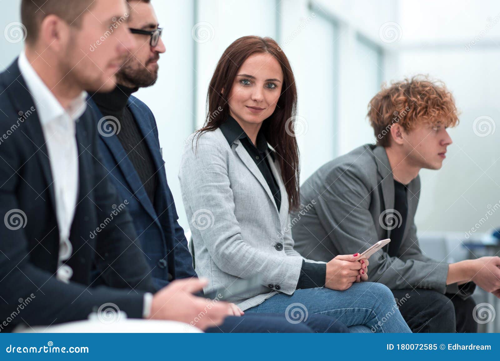 Group of Young People Waiting, Sitting in the Queue Stock Image - Image ...